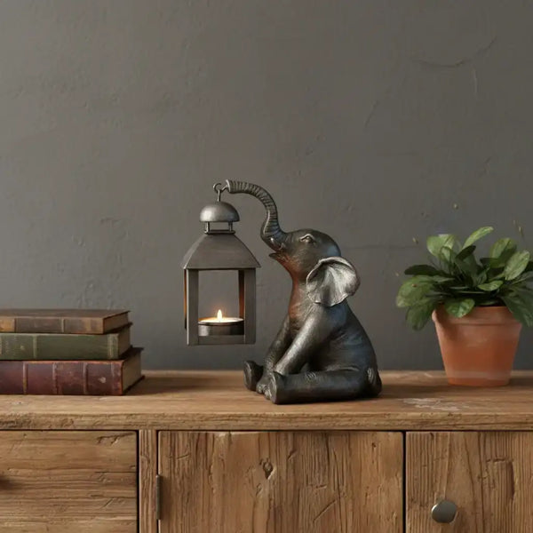 Sitting Elephant Holding a Lantern